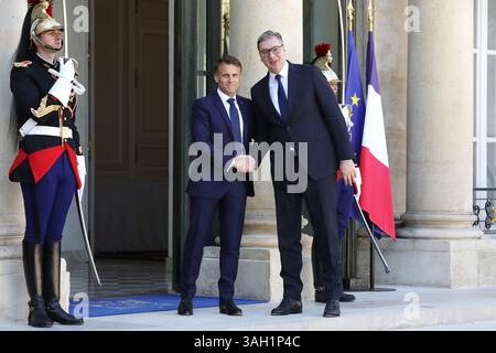 French President Emmanuel Macron (R) and his Serbian counterpart ...