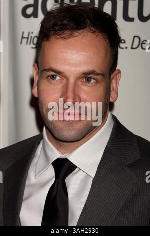 JONNY LEE MILLER arriving at the Only Make Believe 10th Anniversary ...