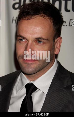 JONNY LEE MILLER arriving at the Only Make Believe 10th Anniversary ...