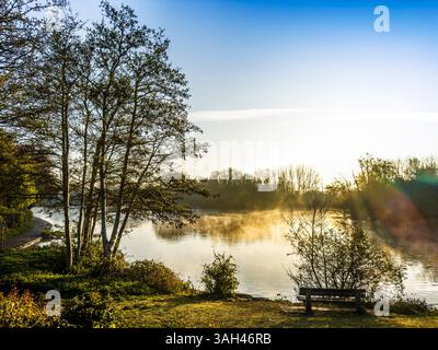Sunrise over a small lake known as Liden Lagoon in Swindon, Wiltshire ...
