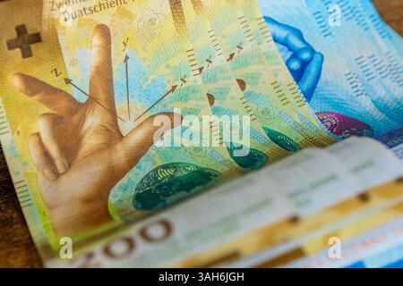 Switzerland money, Bundle of 100 and 200 Swiss francs banknotes ...