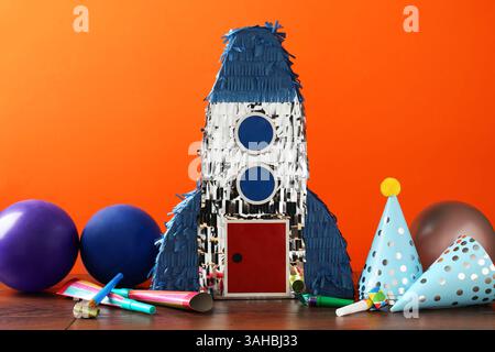 Mexican pinata and table with party hats in living room Stock Photo - Alamy