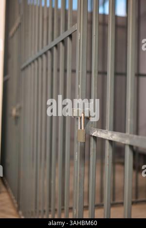 Police station detention room, iron bars Stock Photo - Alamy