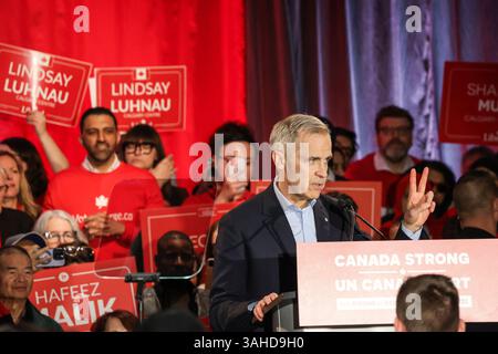 Prime Minister Mark Carney holds up the first ball pulled for the FIFA ...