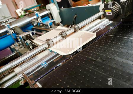 Innovative machine efficiently folds cardboard box flaps for ...