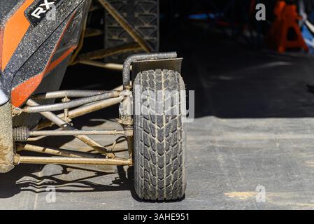 off road buggy wheel and suspension close up after a competition after ...