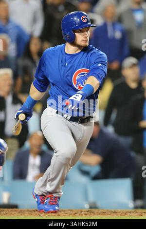 Chicago Cubs' Ian Happ, right, is tagged out at home by St. Louis ...