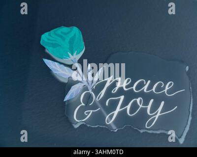 Red rose with text „peace and joy“ Stock Photo - Alamy