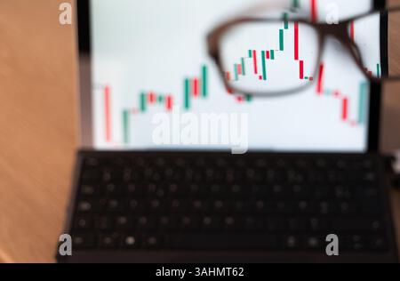 A screen displays stock market trends in Shanghai, China, 2 February ...