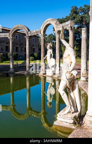 Roman ruins used as decoration for a pond in a italian garden Stock ...