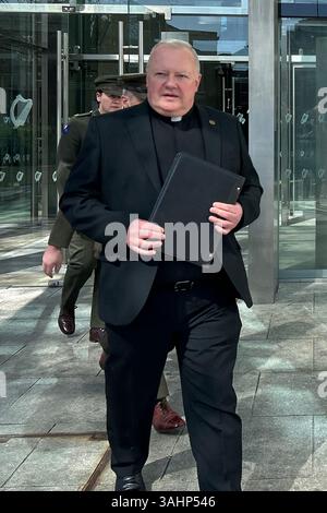 Fr Paul Murphy exits the Central Criminal Court in Dublin after giving ...