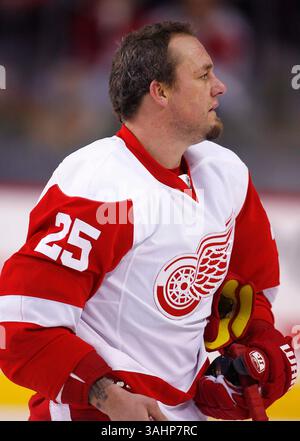Detroit Red Wings' Darren McCarty, left, checks Columbus Blue Jackets ...