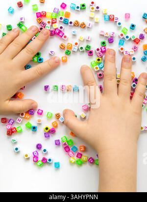 Child cubes and the word hello. Selective focus. Kid Stock Photo - Alamy