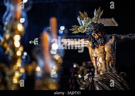 The crucified figure of the Hermandad del Amor is illuminated by ...