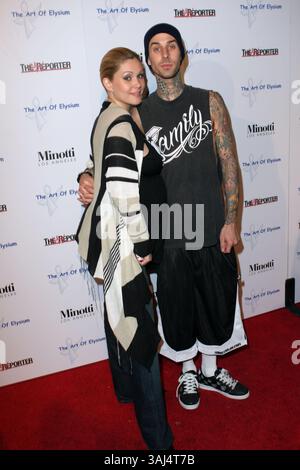 Travis Barker (R) and his wife (L) at the Art of Elysium exhibiting ...