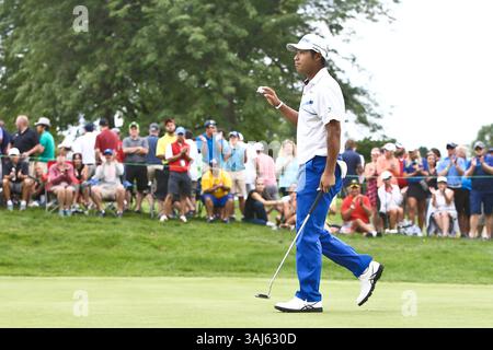 Hideki Matsuyama, of Japan, waves after winning the Masters golf ...
