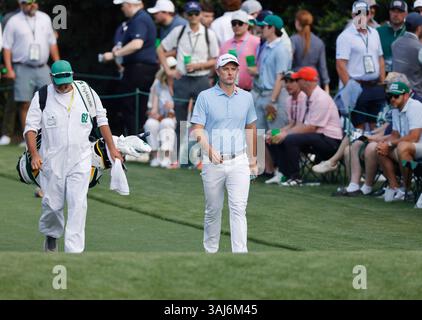 Justin Rose, of England, walks on the 13th hole during a practice round ...