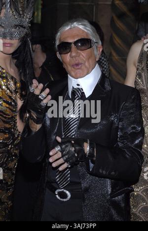 Designer Roberto Cavalli dressed as designer Karl Lagerfeld attends the ...