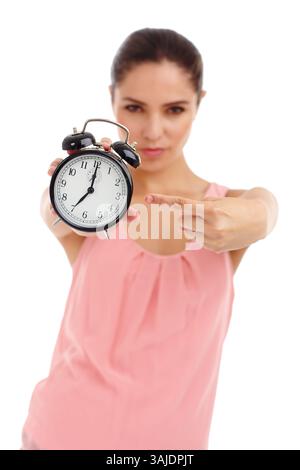 Female hands pointing at alarm clock on lilac background Stock Photo ...