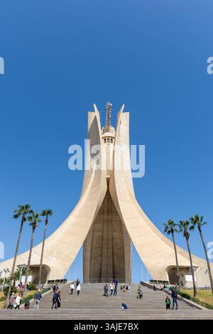 A group of people in Maqam Echahid Monument Square in Algiers City ...