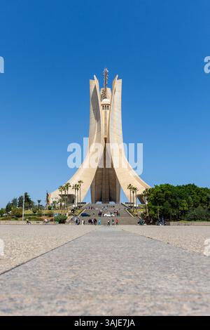 A group of people in Maqam Echahid Monument Square in Algiers City ...