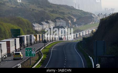 Lorries queue along the A20 outside Dover in Kent as the TAP traffic ...