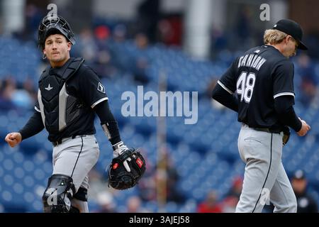 Chicago White Sox catcher Jonathan Lucroy pauses with the baseball ...