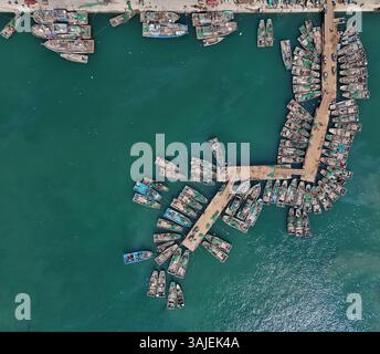 YANTAI, CHINA - APRIL 11, 2025 - Fishing boats take shelter from ...