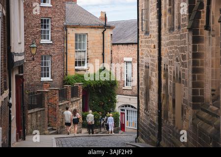 Durham, UK - June 22 2024: Picturesque cobblestone lane with charming ...