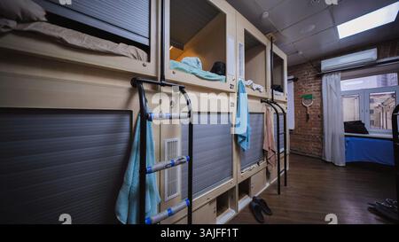 Capsule hotel room showing individual sleeping boxes offering privacy ...