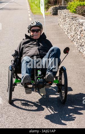 Senior man riding recumbent trike in County Kerry, Ireland Stock Photo ...