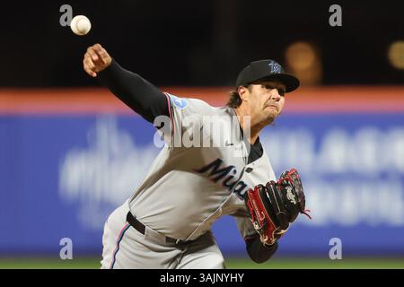 Miami Marlins pitcher Tyler Phillips adjusts his hat after giving up a ...