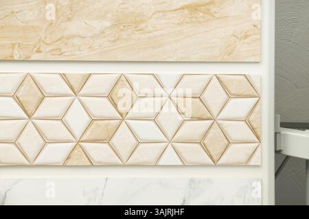 Samples of tiles with different patterns on display in store Stock ...