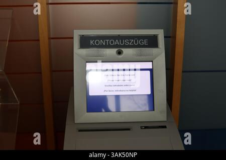 Statement printer in your bank branch Stock Photo - Alamy