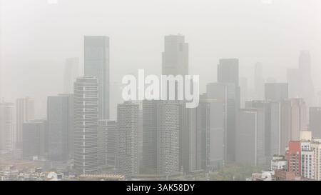 CHONGQING, CHINA - APRIL 12, 2025 - Tourists watch a drone light show ...
