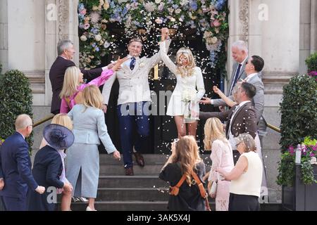 News broadcaster Ellie Costello and her new husband Gerard Durkan pose ...