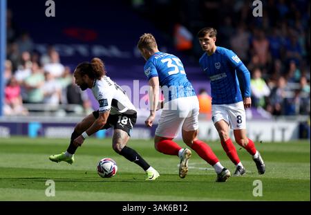 Derby County's Marcus Harness (left) and Kane Wilson inspect the pitch ...