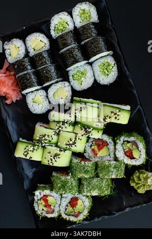 photo of set of delicious sushi on dark background Stock Photo - Alamy