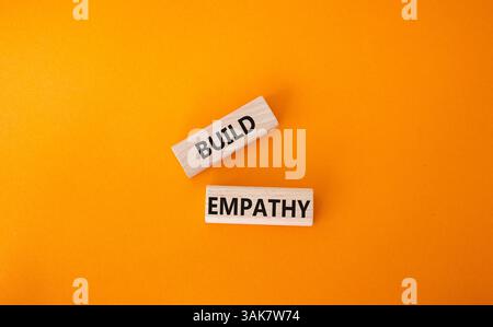 Build empathy symbol. Wooden blocks with words Build empathy. Beautiful ...