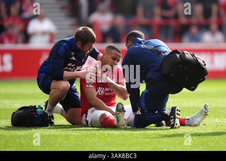 Murillo of Nottingham Forest receives treatment during the Premier ...