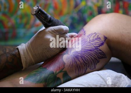 Tattoo artists and enthusiasts get tattooed during the ''Nepal Tattoo ...