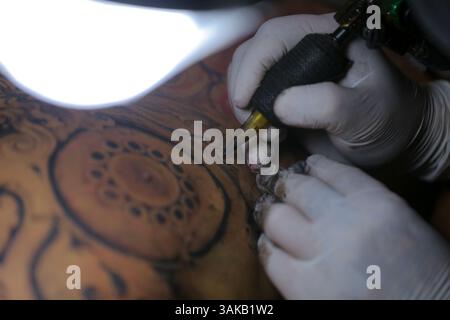 Tattoo artists and enthusiasts get tattooed during the ''Nepal Tattoo ...