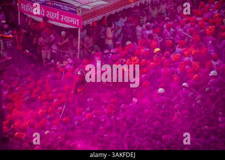 People throw Gulal a red color powder at the Palkhi (Planquin) of ...