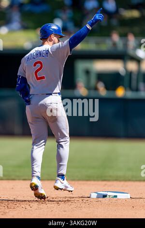 Chicago Cubs' Kyle Tucker singles during the third inning of a baseball ...