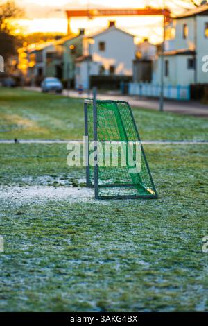 Icy frost on soccer field fence Stock Photo - Alamy