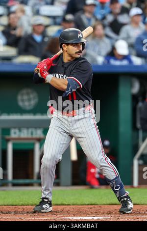 Minnesota Twins second baseman Mickey Gasper (11) throws to first base ...