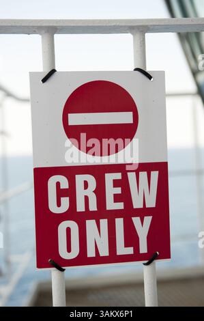 a sign board with crew only on a ship at the sea Stock Photo - Alamy