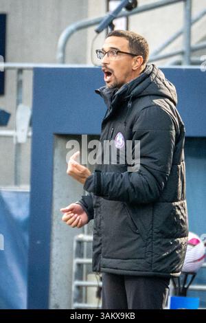 Orlando Pride head coach Seb Hines, center, talks to the team during a ...