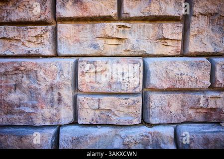 Stone wall with rough texture in bright light Stock Photo - Alamy