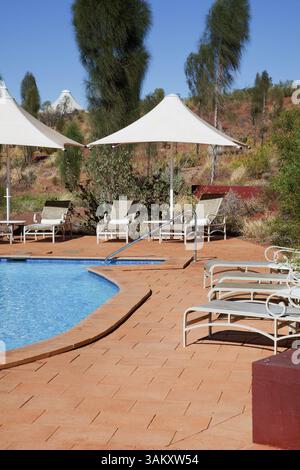Parasols and sun loungers at swimming pools, parasol Stock Photo - Alamy